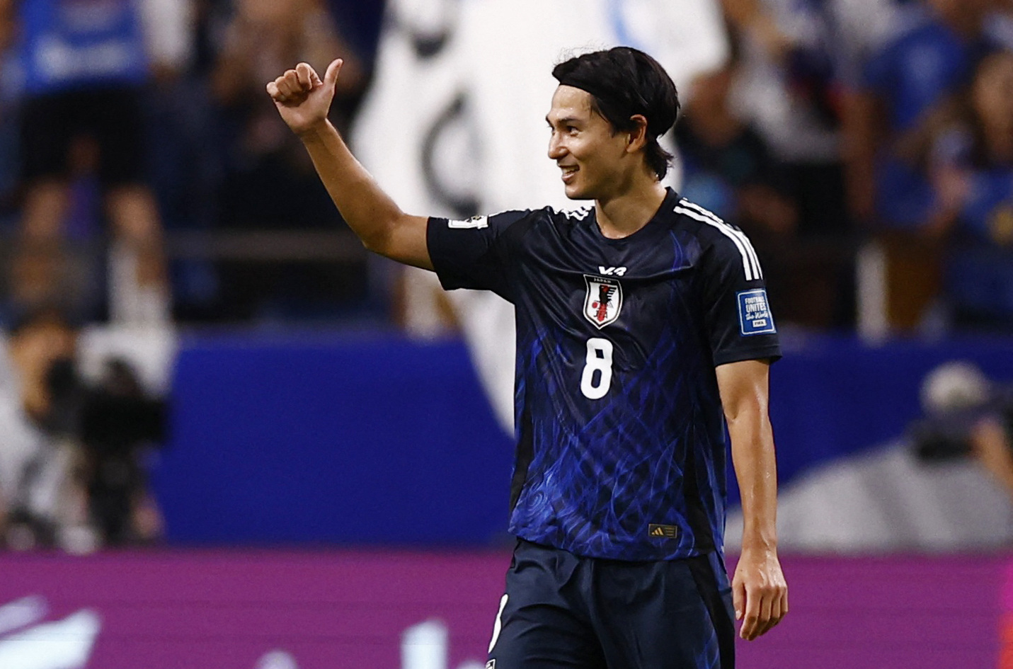 Minamino hits double as clinical Japan thrash China | Reuters