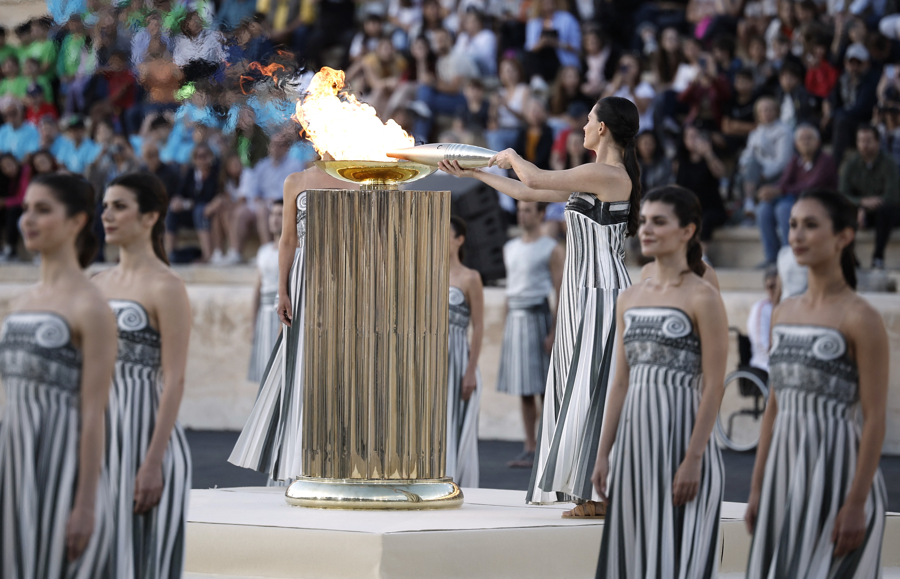 Paris organisers receive flame in Athens ahead of relay | Reuters