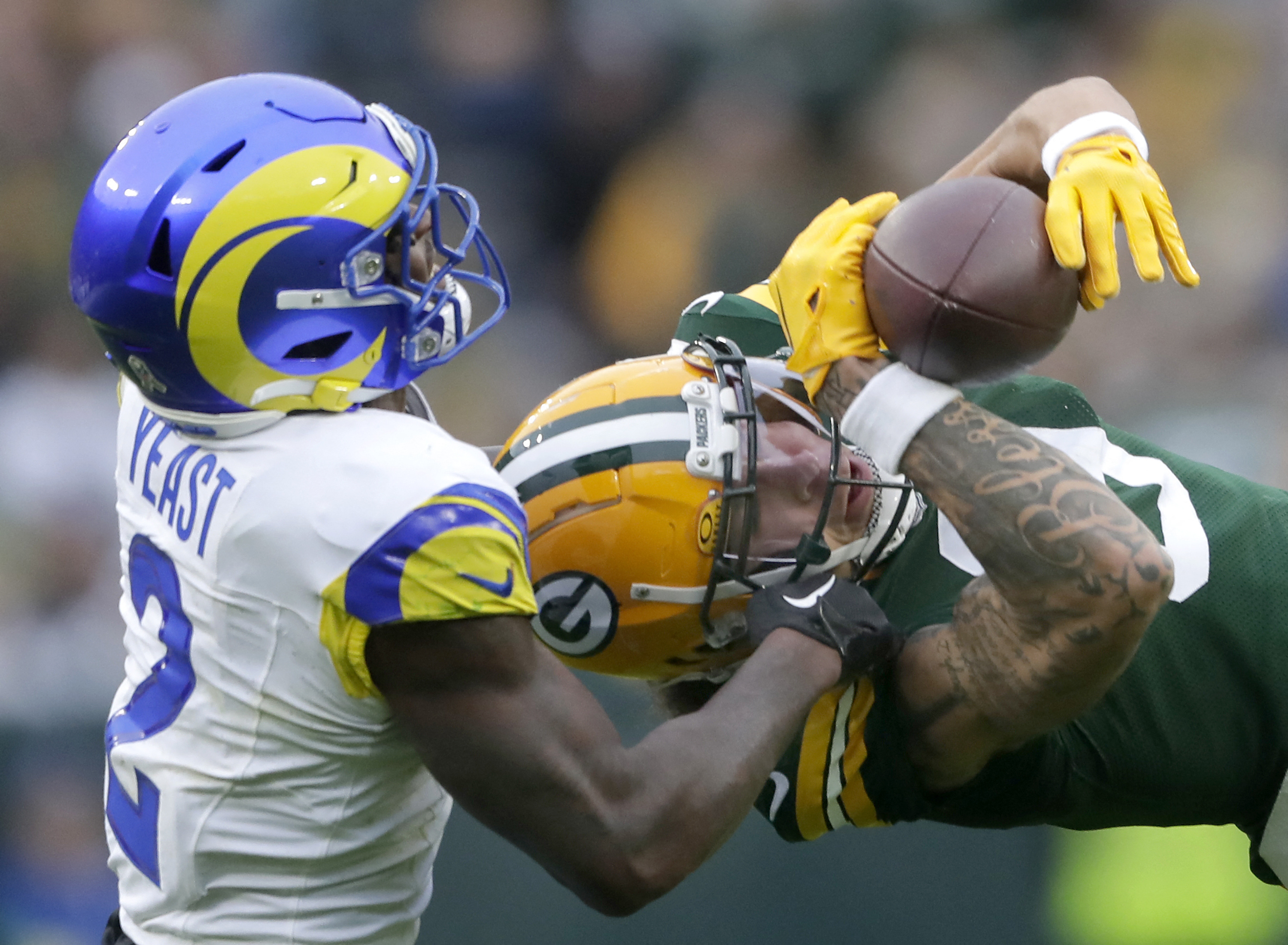 Packers shut down Rams 20-3, end losing skid | Reuters