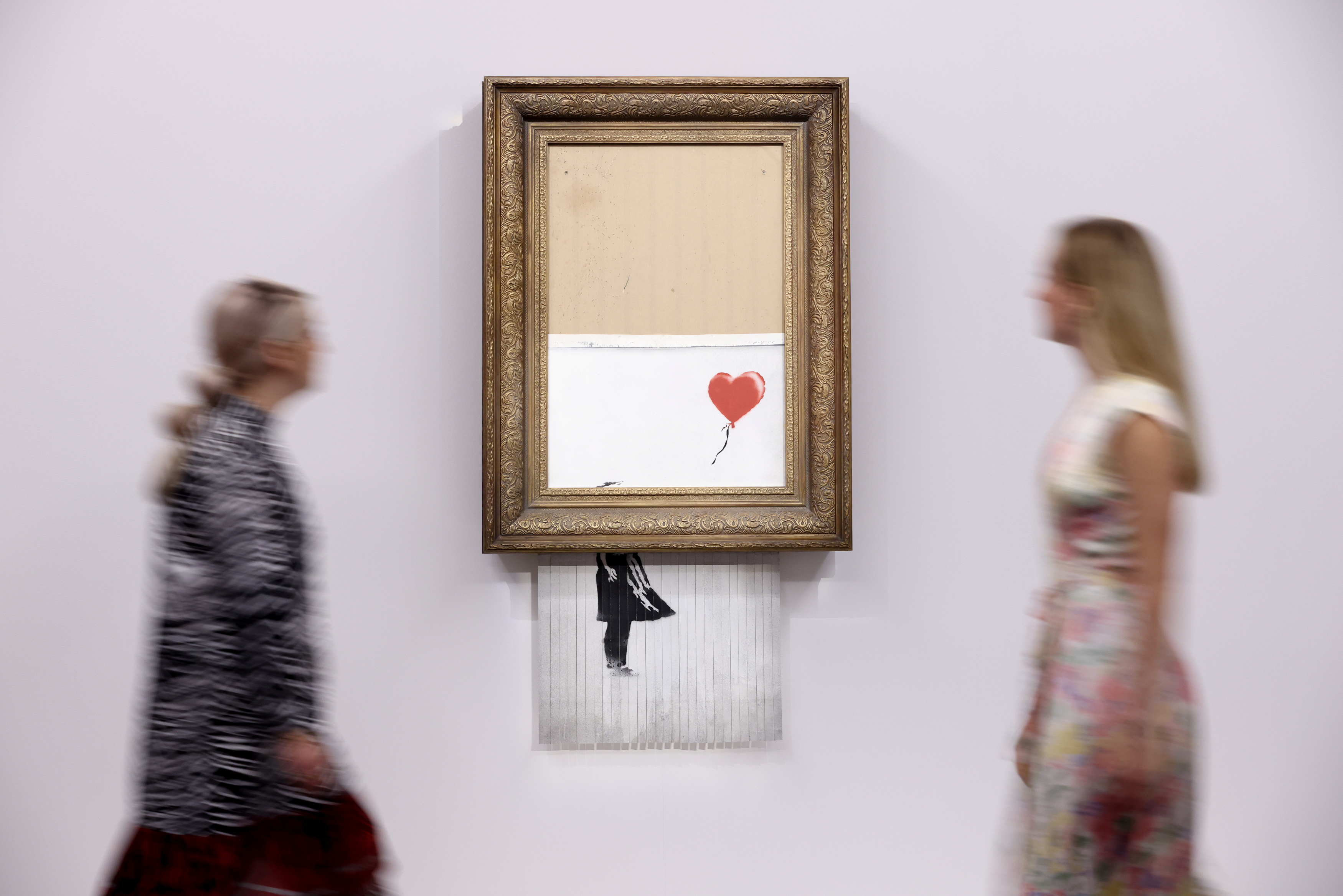 Three years on, shredded Banksy artwork returns to auction | Reuters