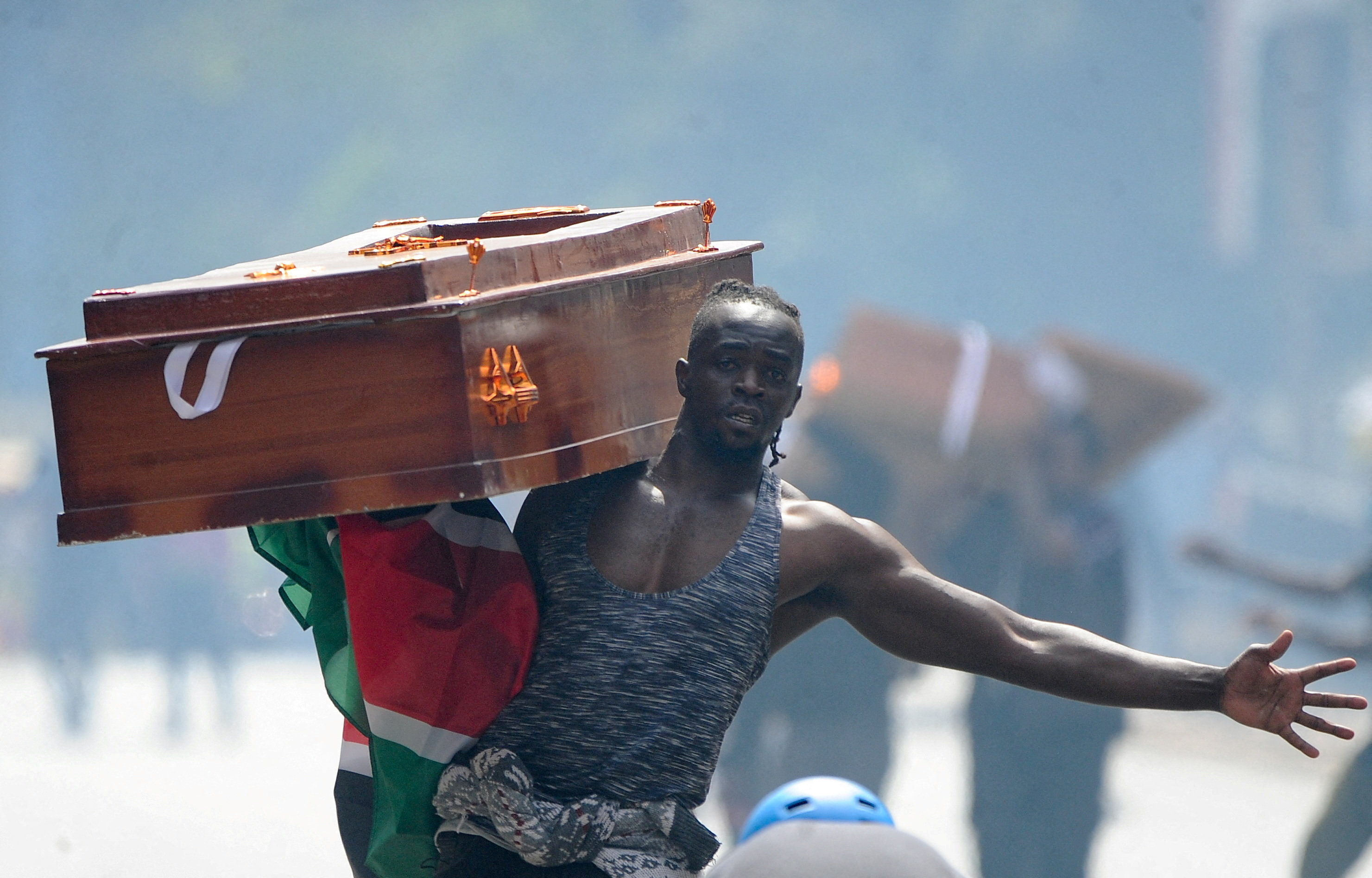 Tear gas, stones and flames as Kenya protesters say 'Ruto must go ...