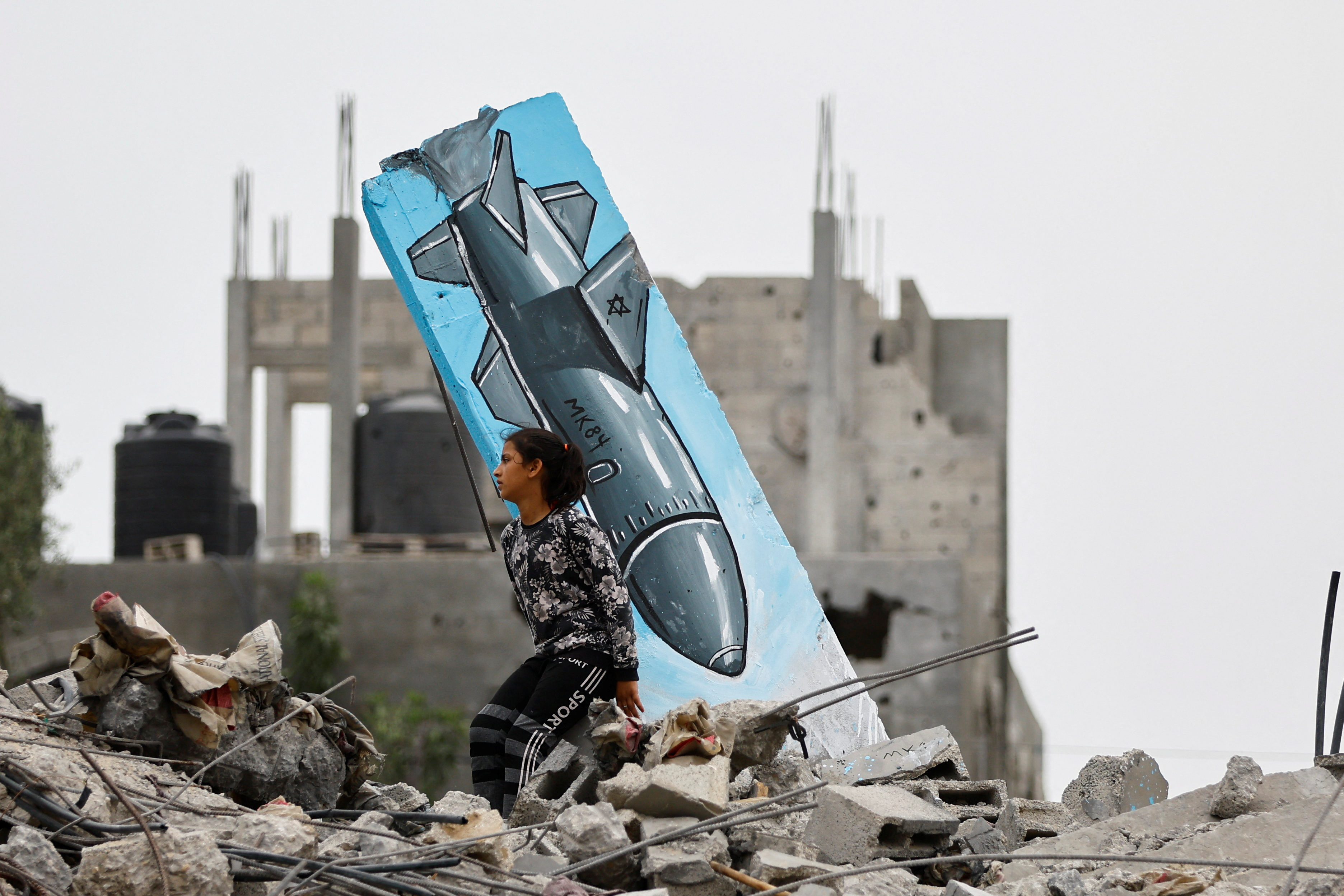 Gaza graffiti artists bedeck houses destroyed by Israel in war | Reuters