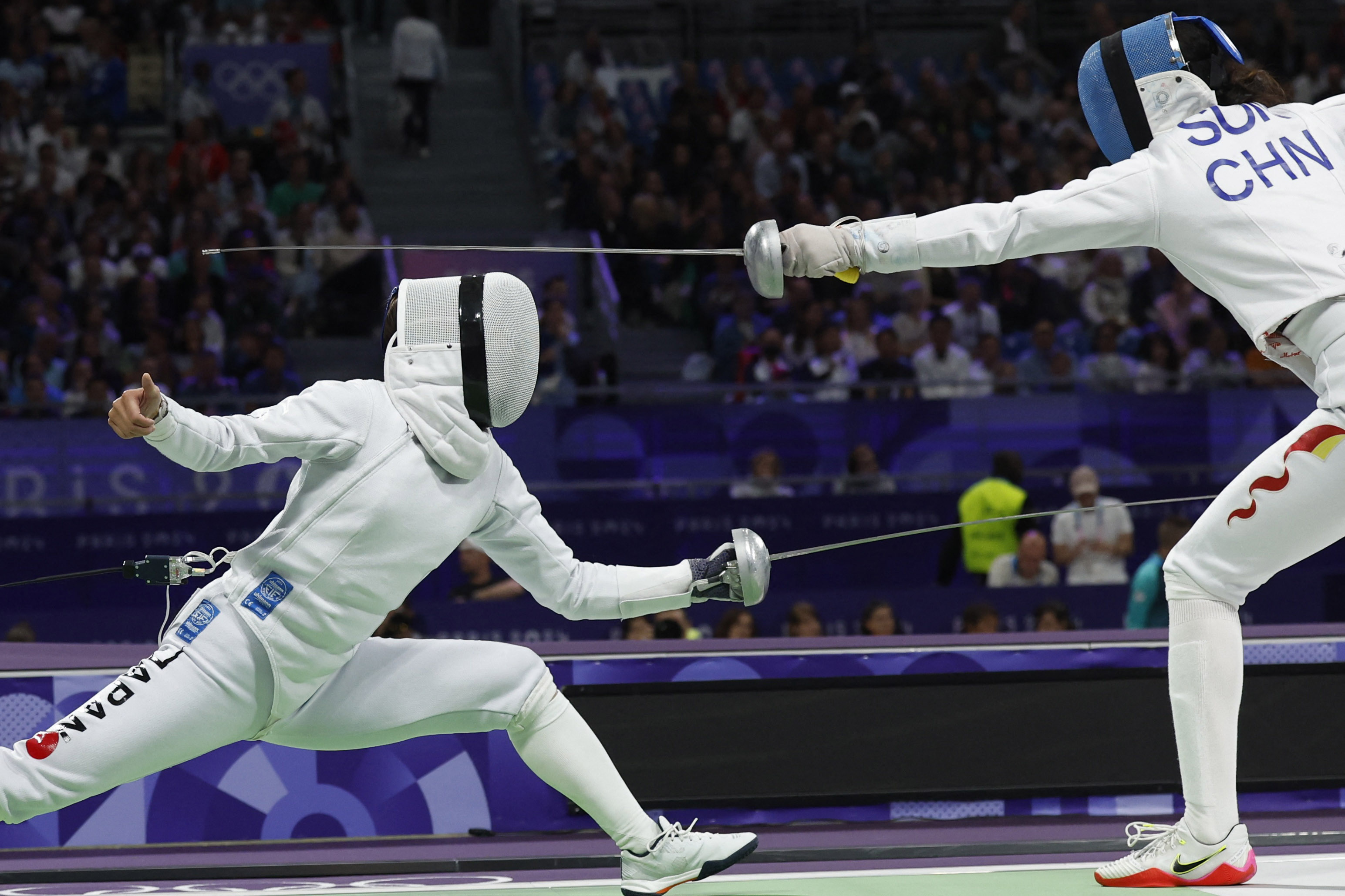 Defending champion fencer Sun Yiwen defeated in sudden-death epee shock ...