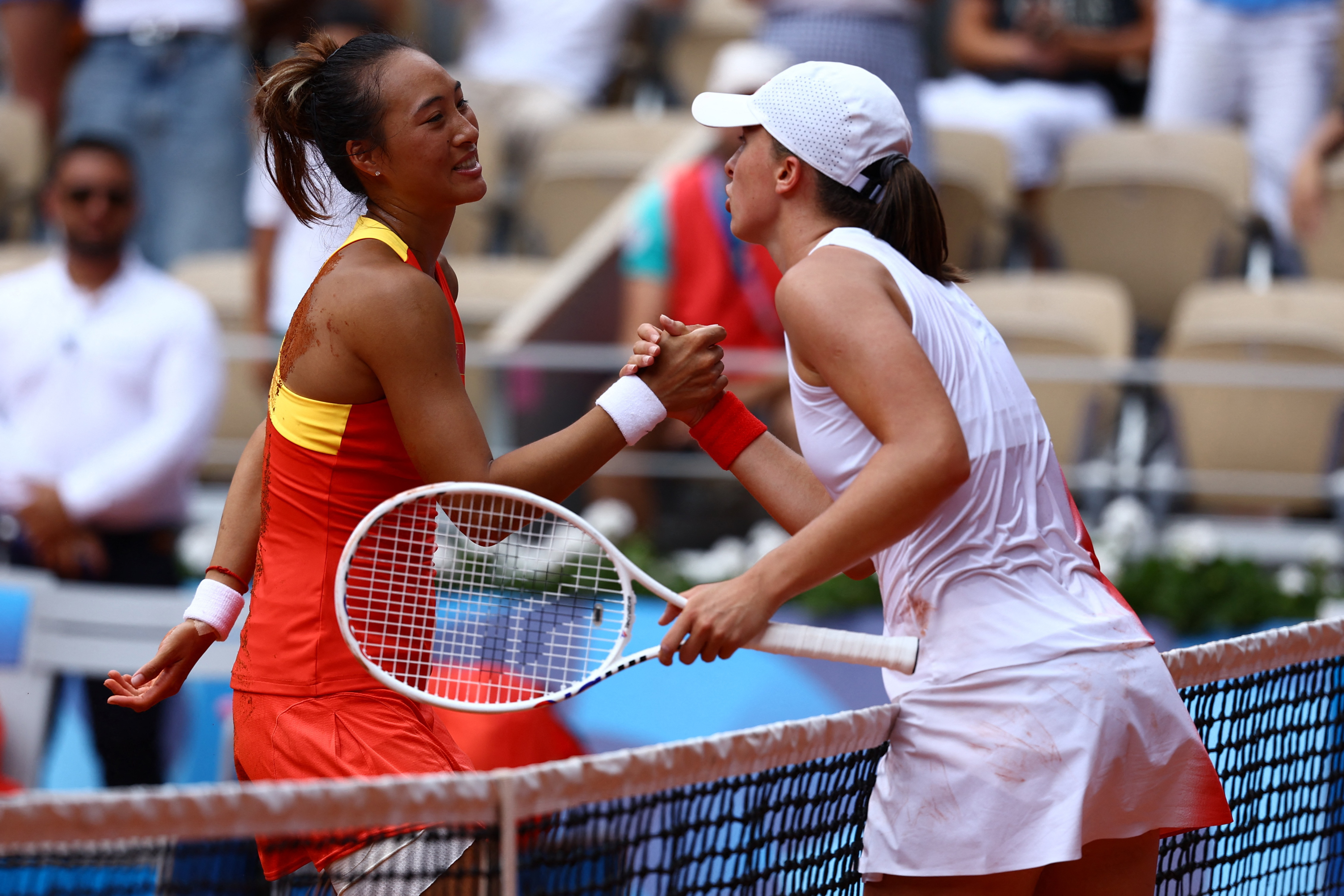Tennis-Chinese joy as Zheng and mixed doubles team make finals | Reuters