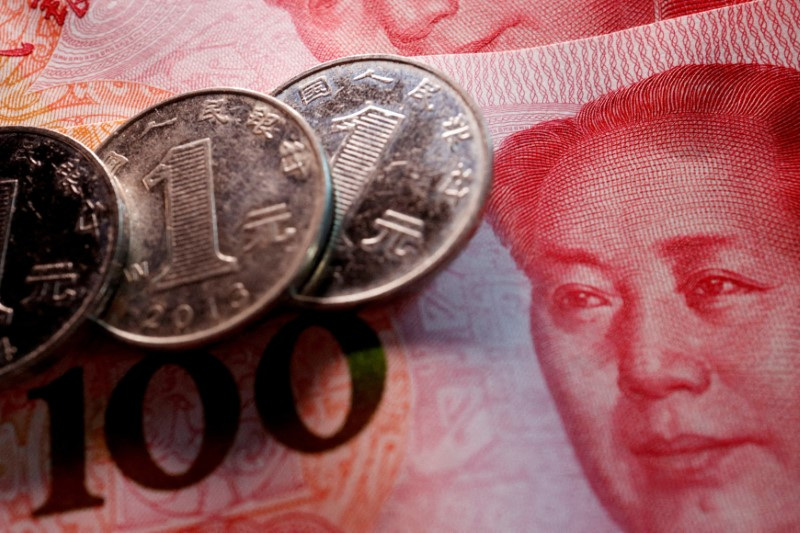 Yuan slide half pulls Beijing out of its inertia | Reuters