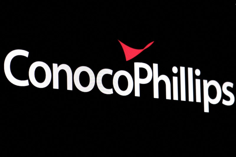 ConocoPhillips posts bigger profit than expected, raises dividend | Reuters