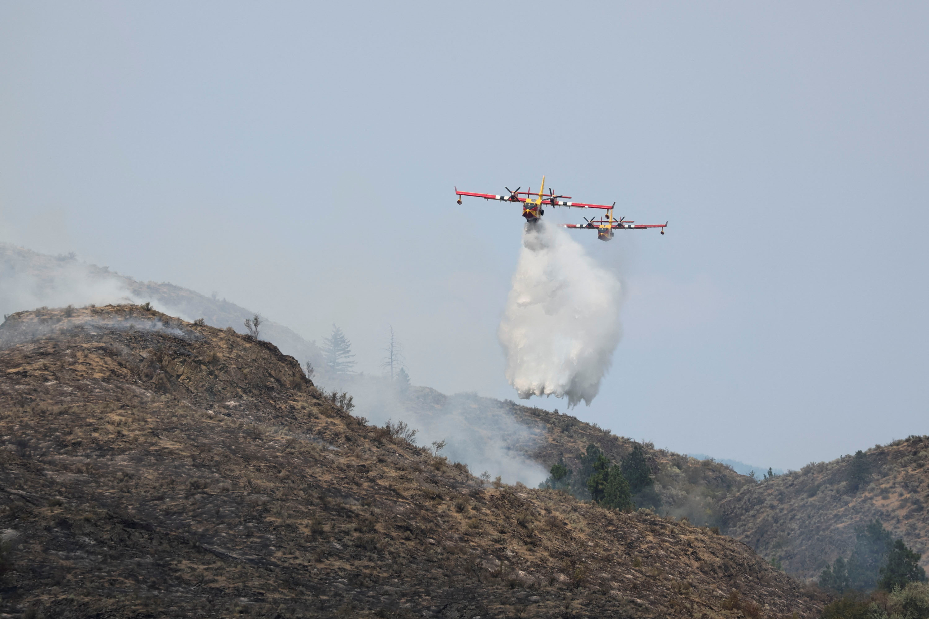 Evacuation order issued for western Canadian town as wildfire crosses ...