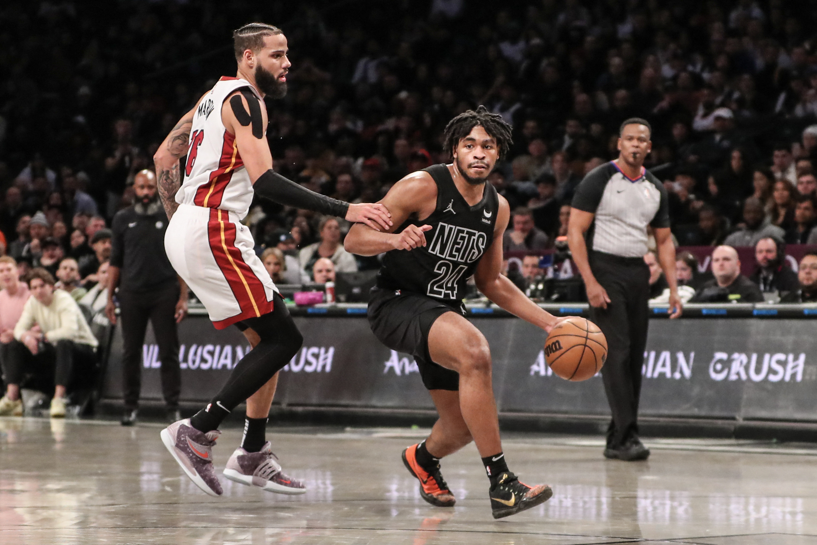 Jimmy Butler returns to guide Heat past Nets in OT | Reuters