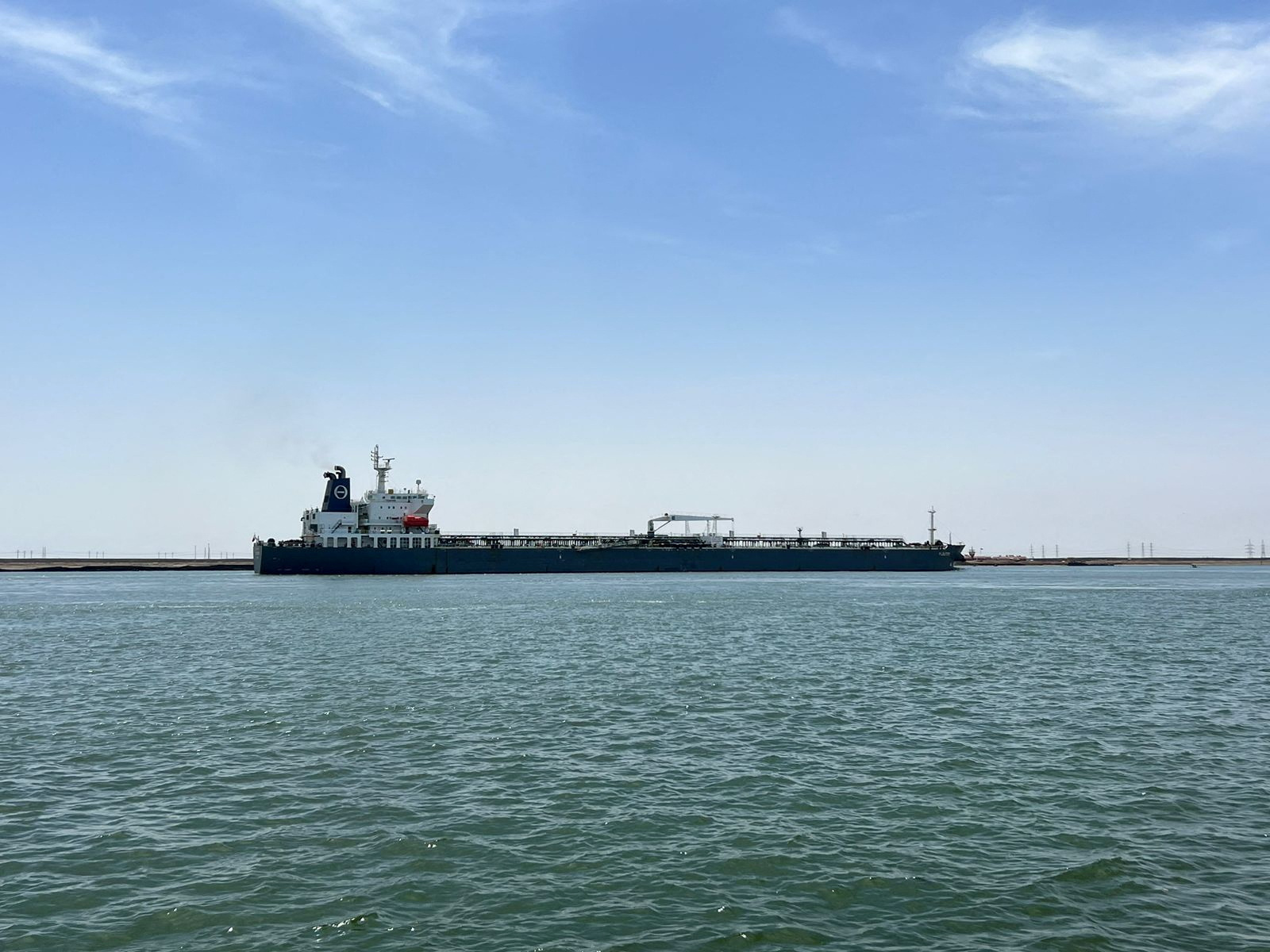 Egypt tows away stranded oil tanker in Suez Canal | Reuters