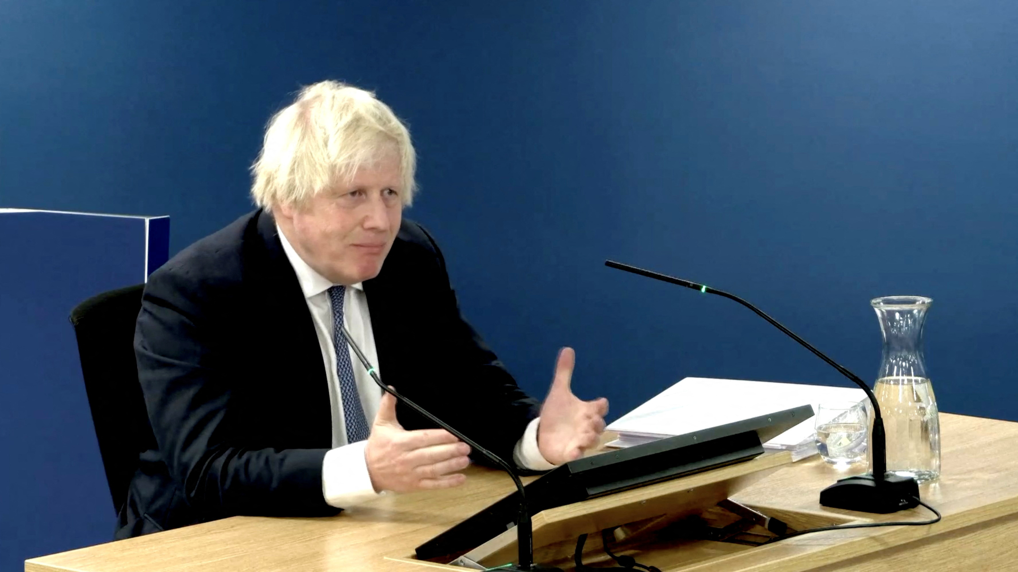 Former UK PM Johnson denies he wanted to let COVID 'rip' | Reuters