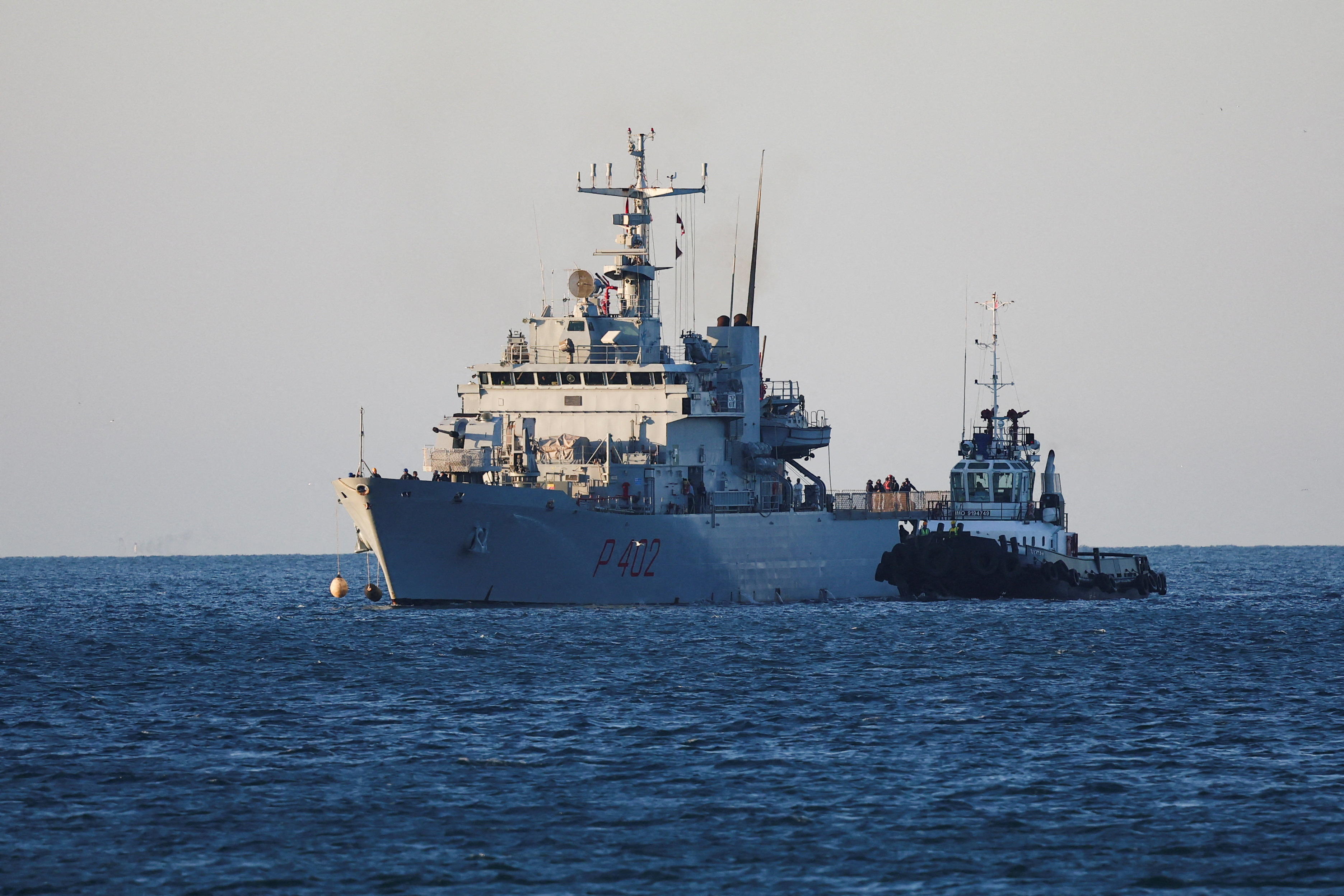 Italy delivers first migrants to Albania under new deal | Reuters