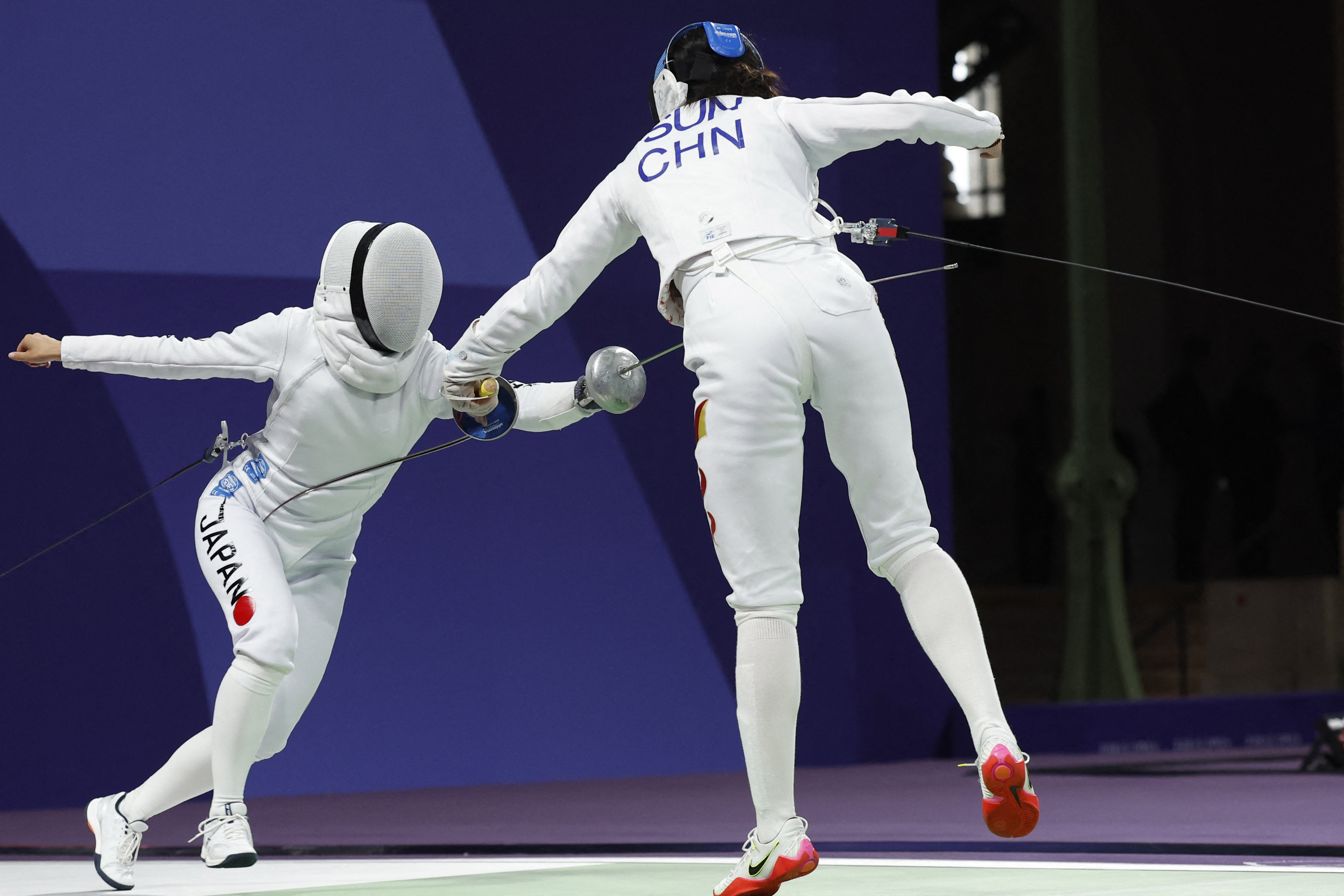 Defending champion fencer Sun Yiwen defeated in sudden-death epee shock | Reuters