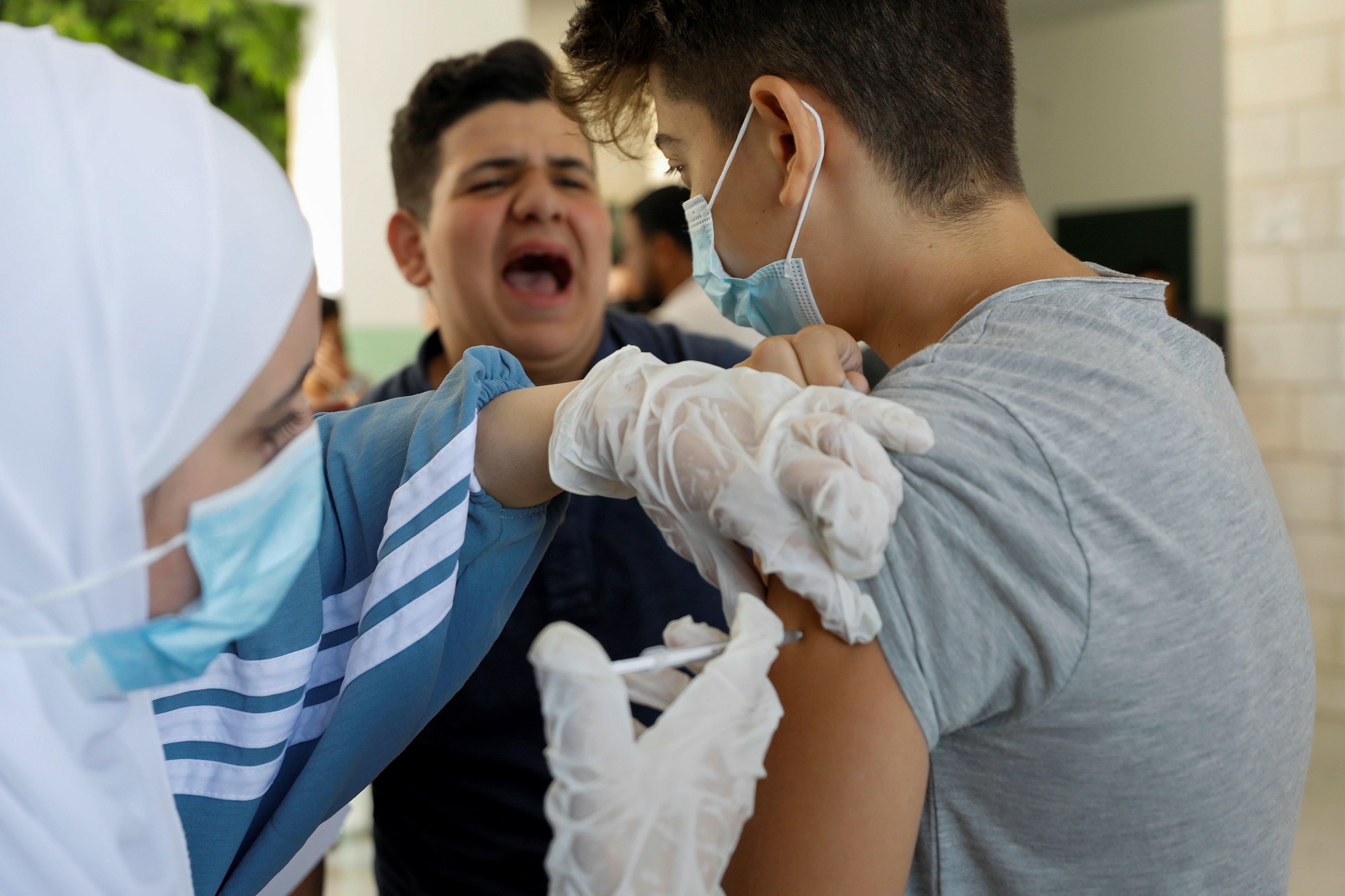COVID vaccine mandates - and prizes - boost uptake among Palestinians ...