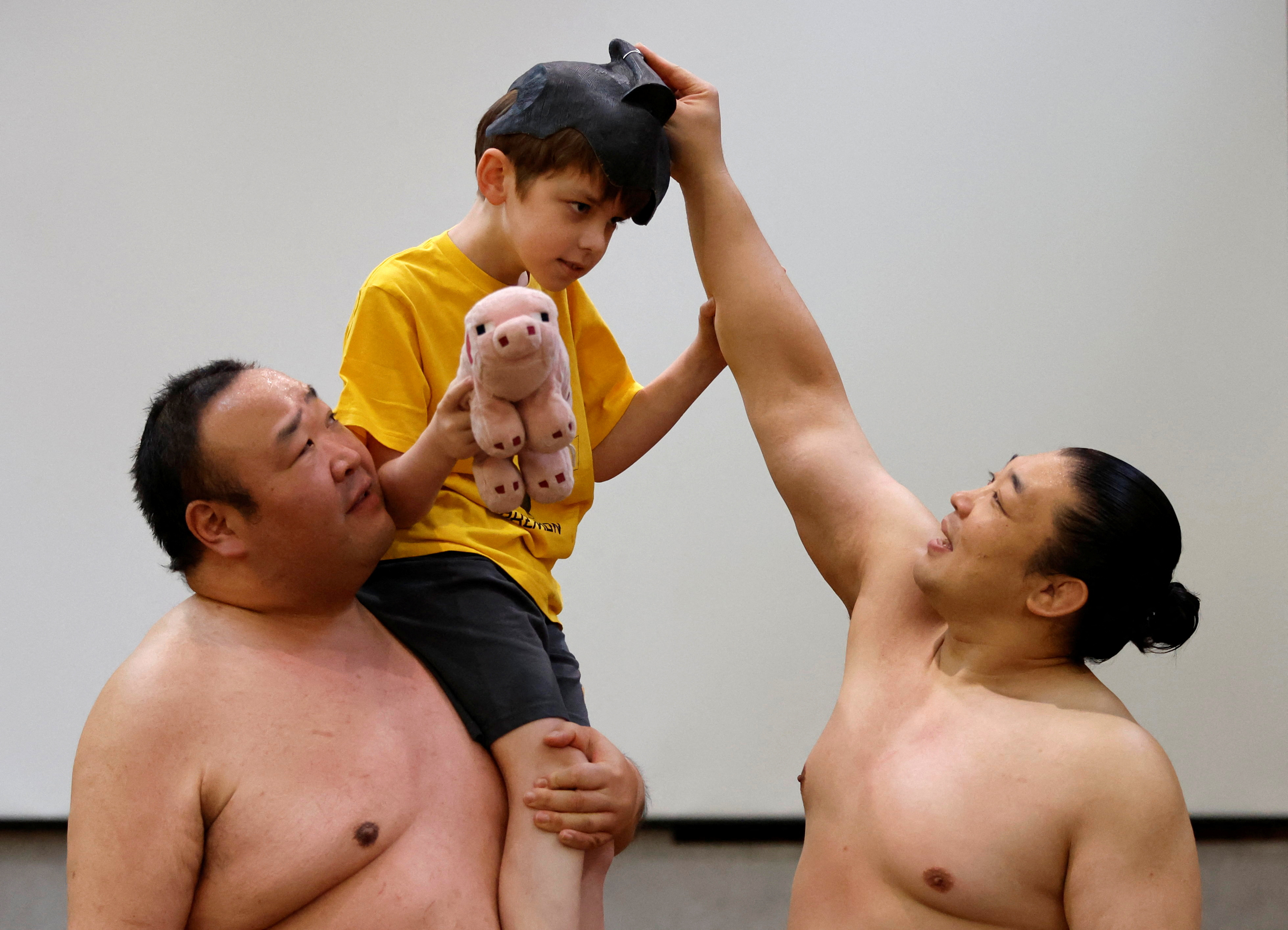 Sumo retirees play for laughs from tourists flooding back to Japan ...