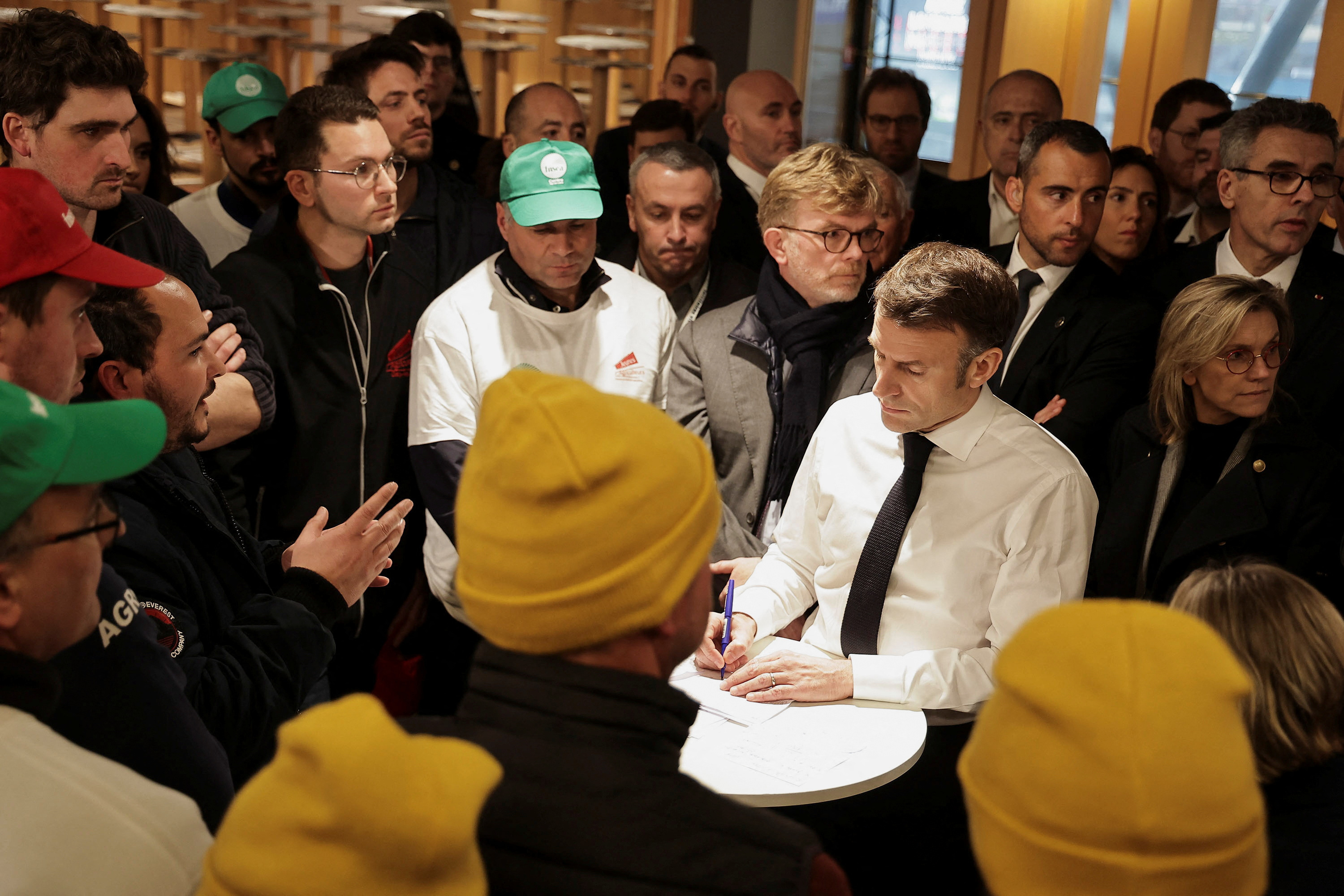 Angry French farmers storm into agriculture fair in Paris | Reuters