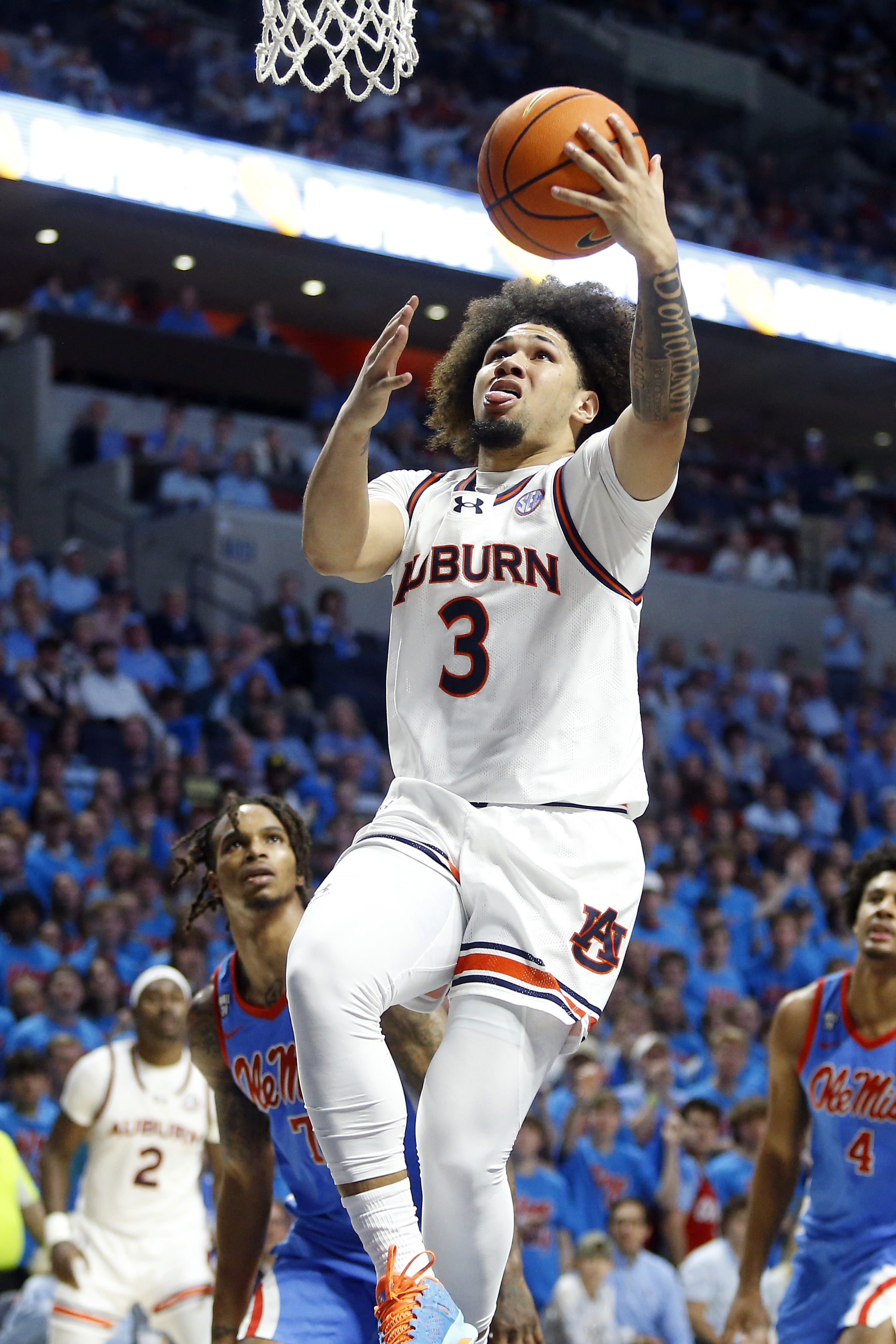 Johni Broome's big 2nd half leads No. 16 Auburn past Ole Miss | Reuters
