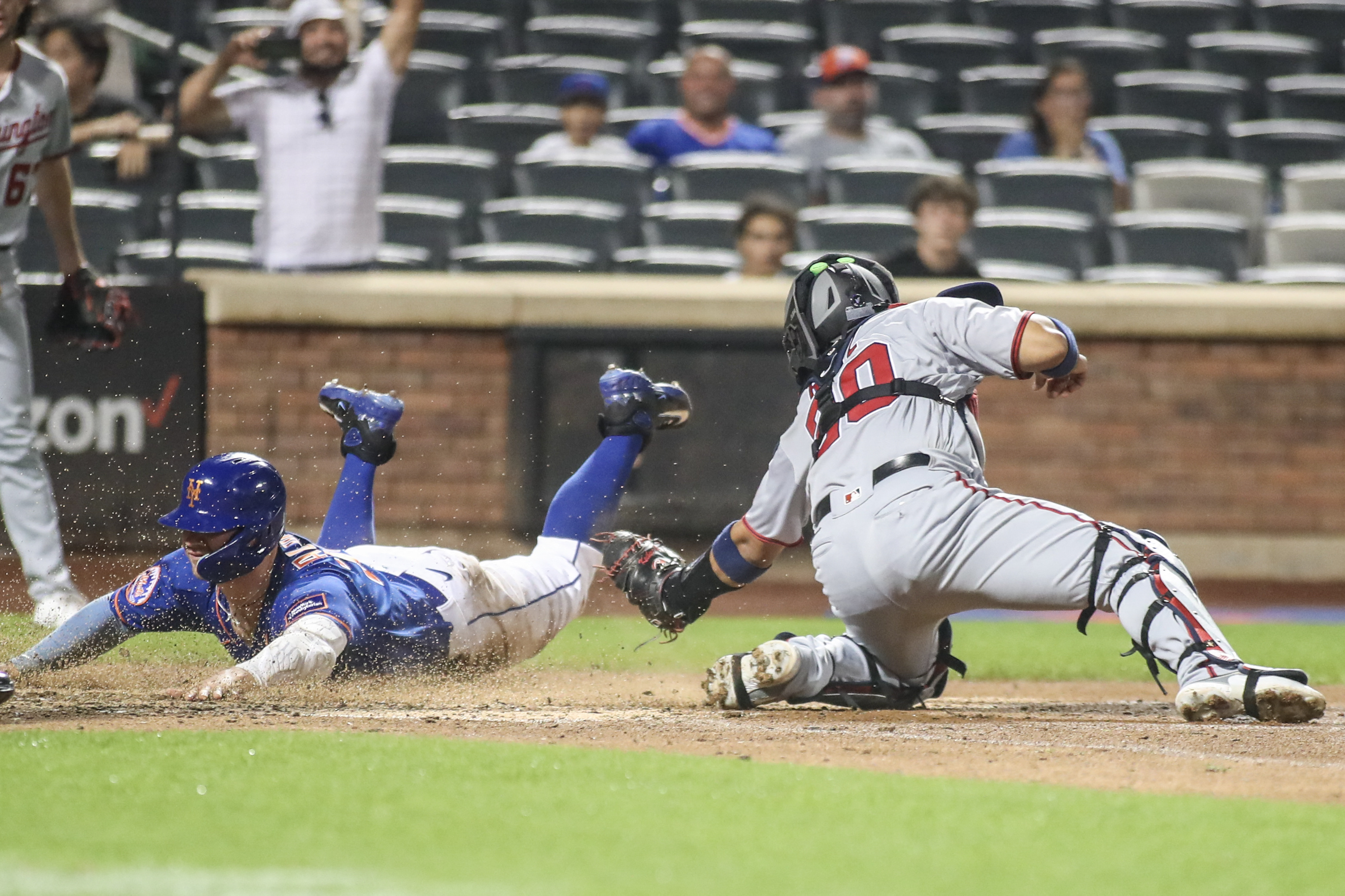 After rain delay, Mets eke out win over Nationals | Reuters