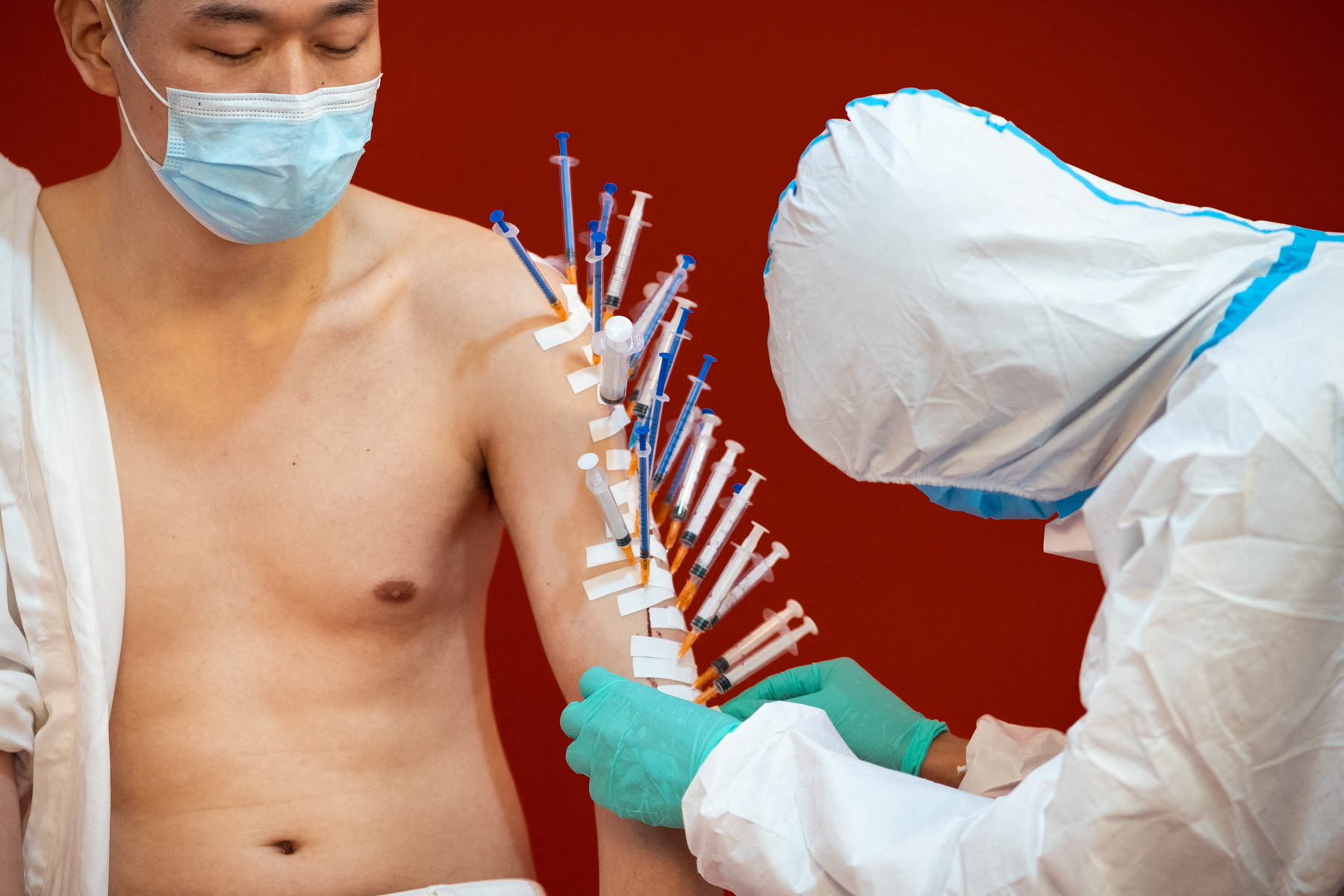 Chinese artist records era of COVID, one test at a time | Reuters