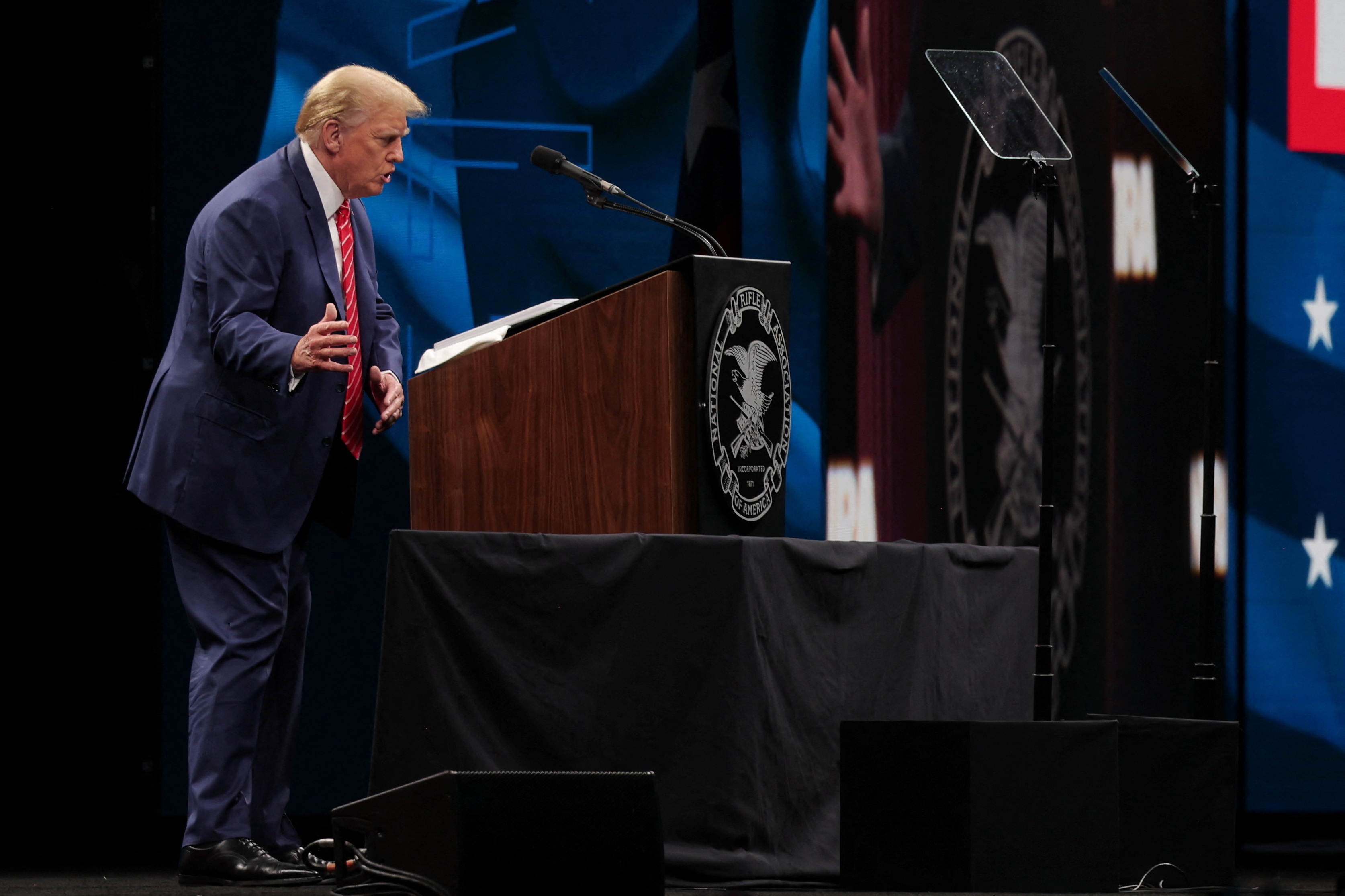 Trump pledges to 'roll back' Biden gun rules, fire ATF chief at NRA ...