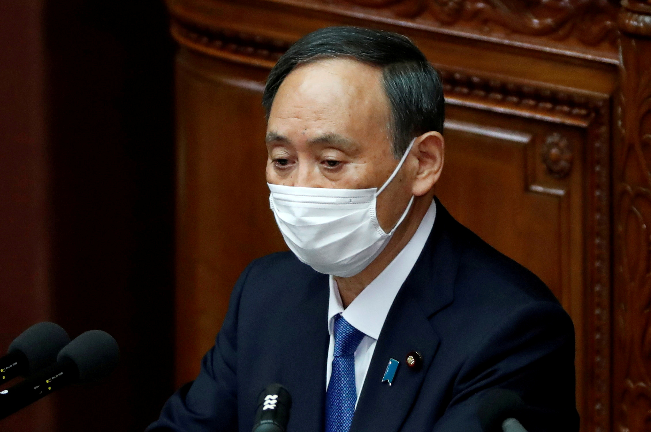Japan PM Suga hints at ending COVID-19 curbs as scheduled | Reuters