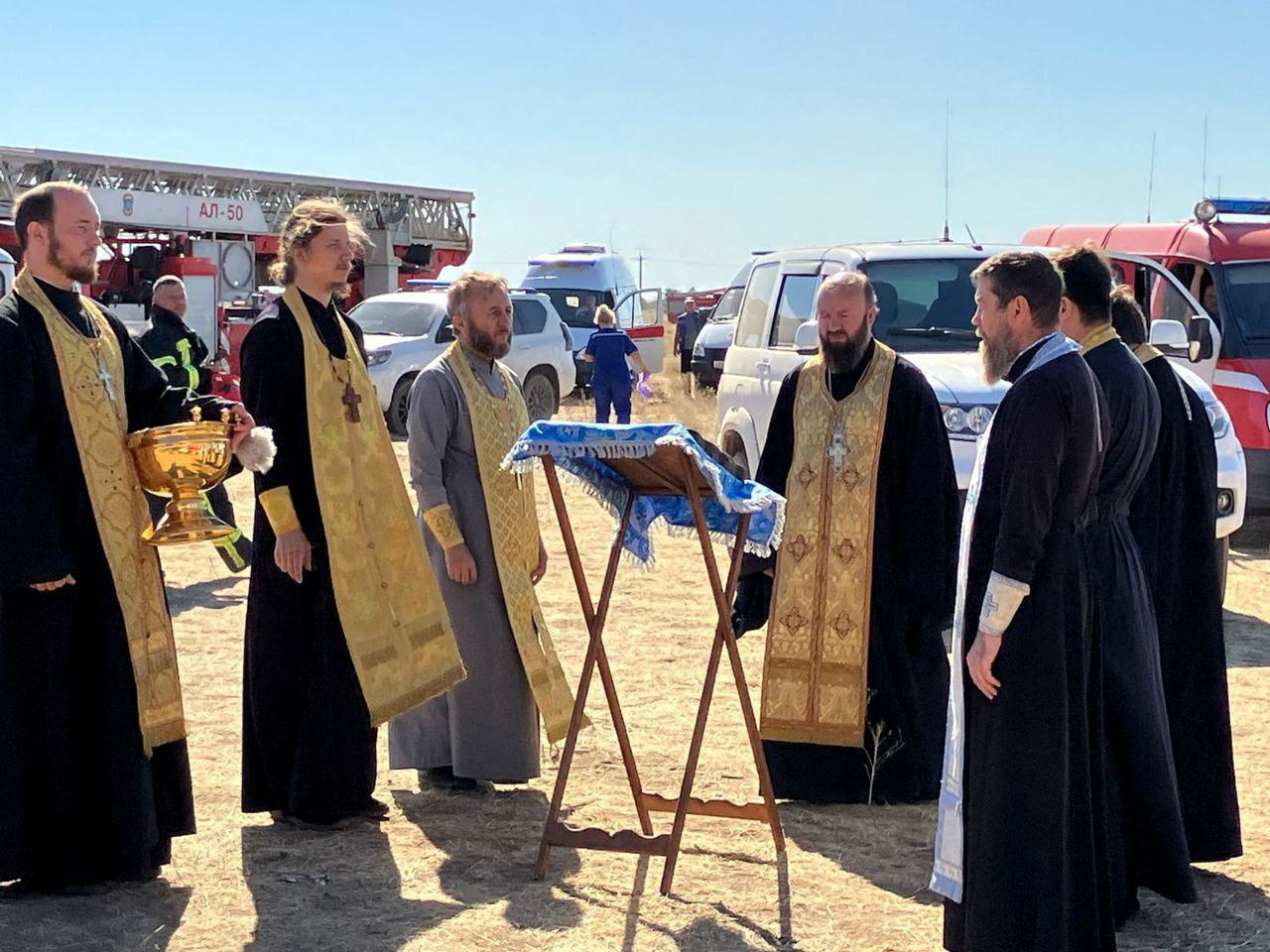 Russian priests bring icon to try to tame depot fire after drone attack ...