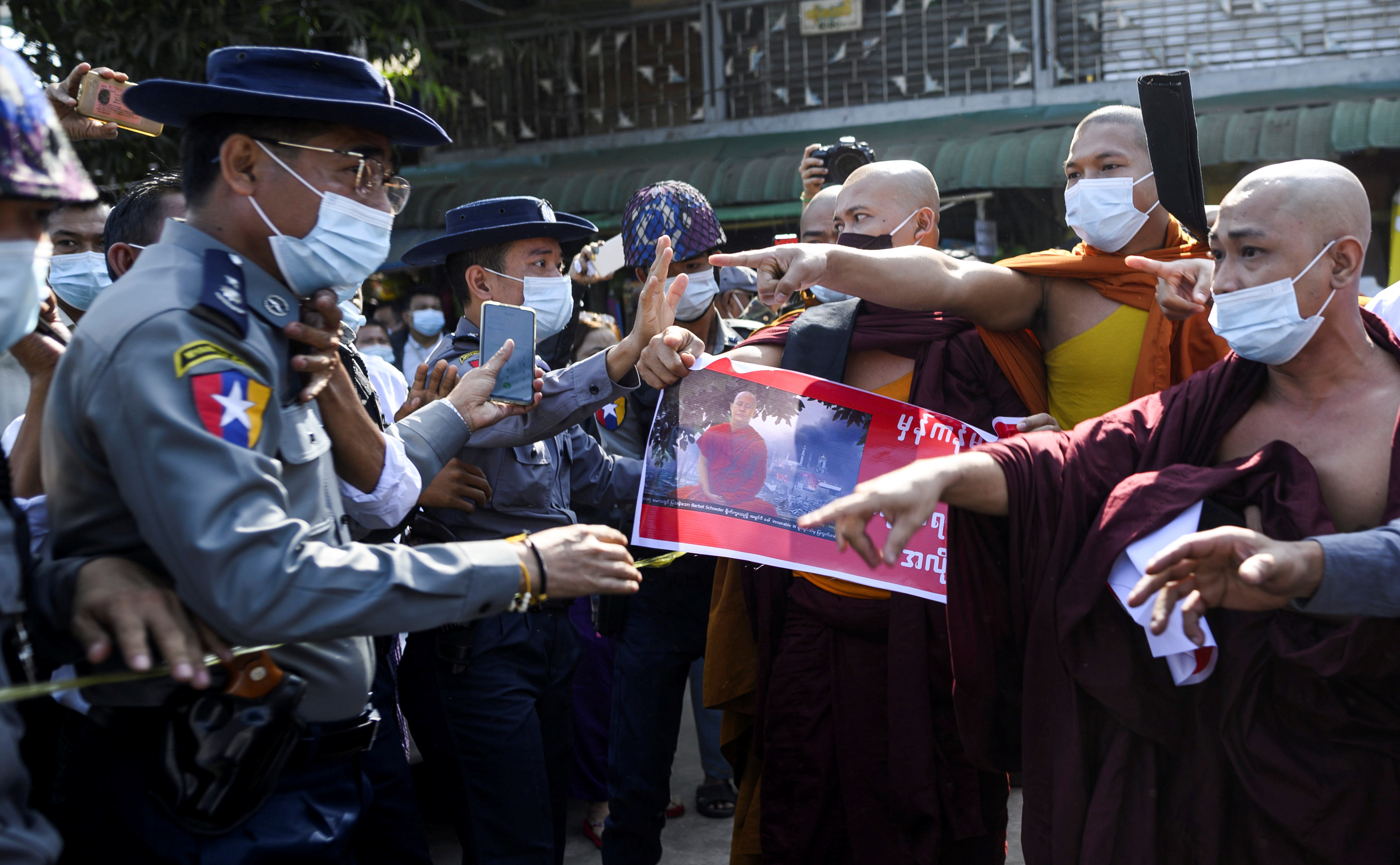 Myanmar police scuffle with nationalist monk's followers | Reuters