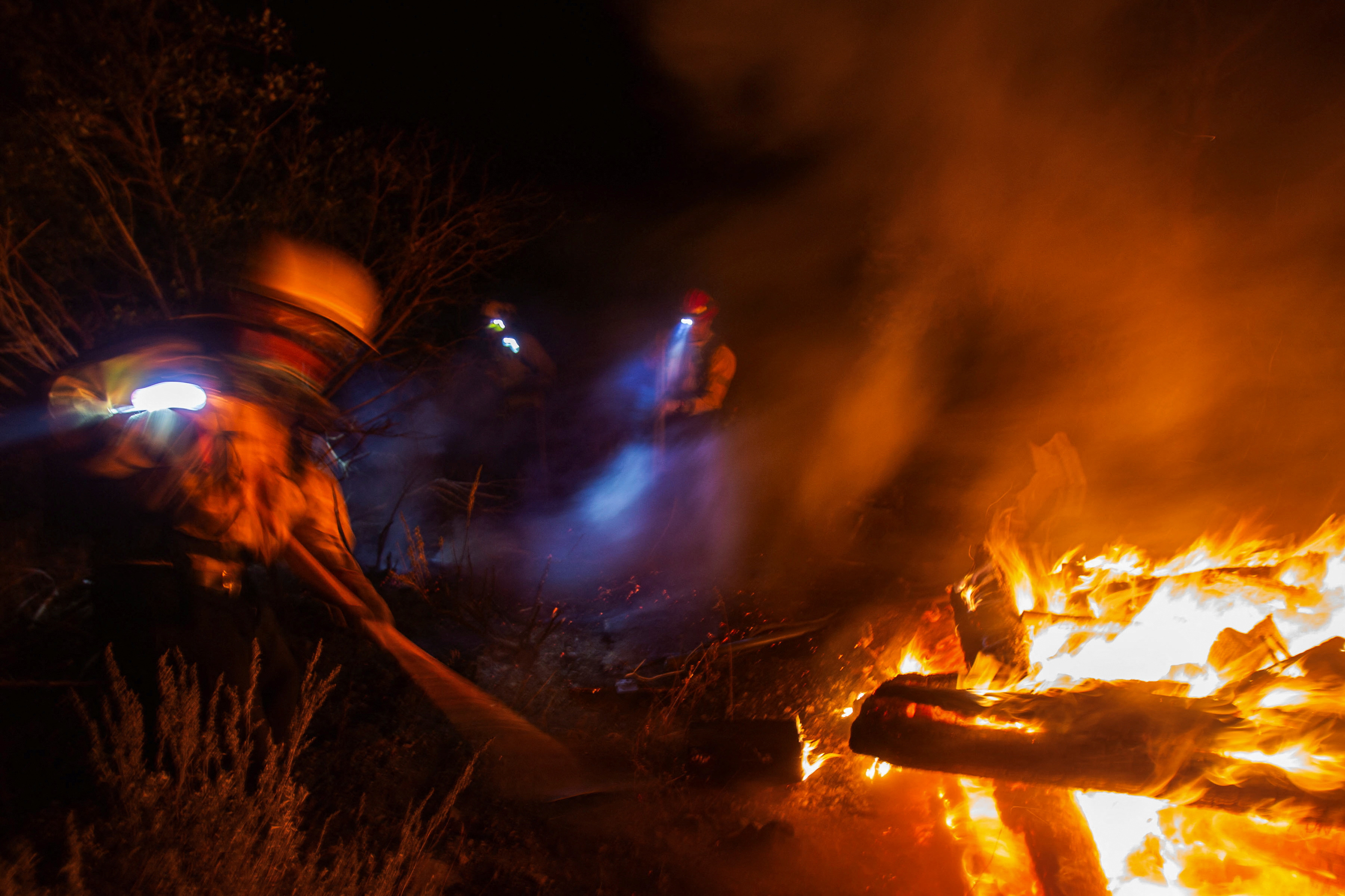 In pictures: California wildfires burn dozens of homes, ski resort ...