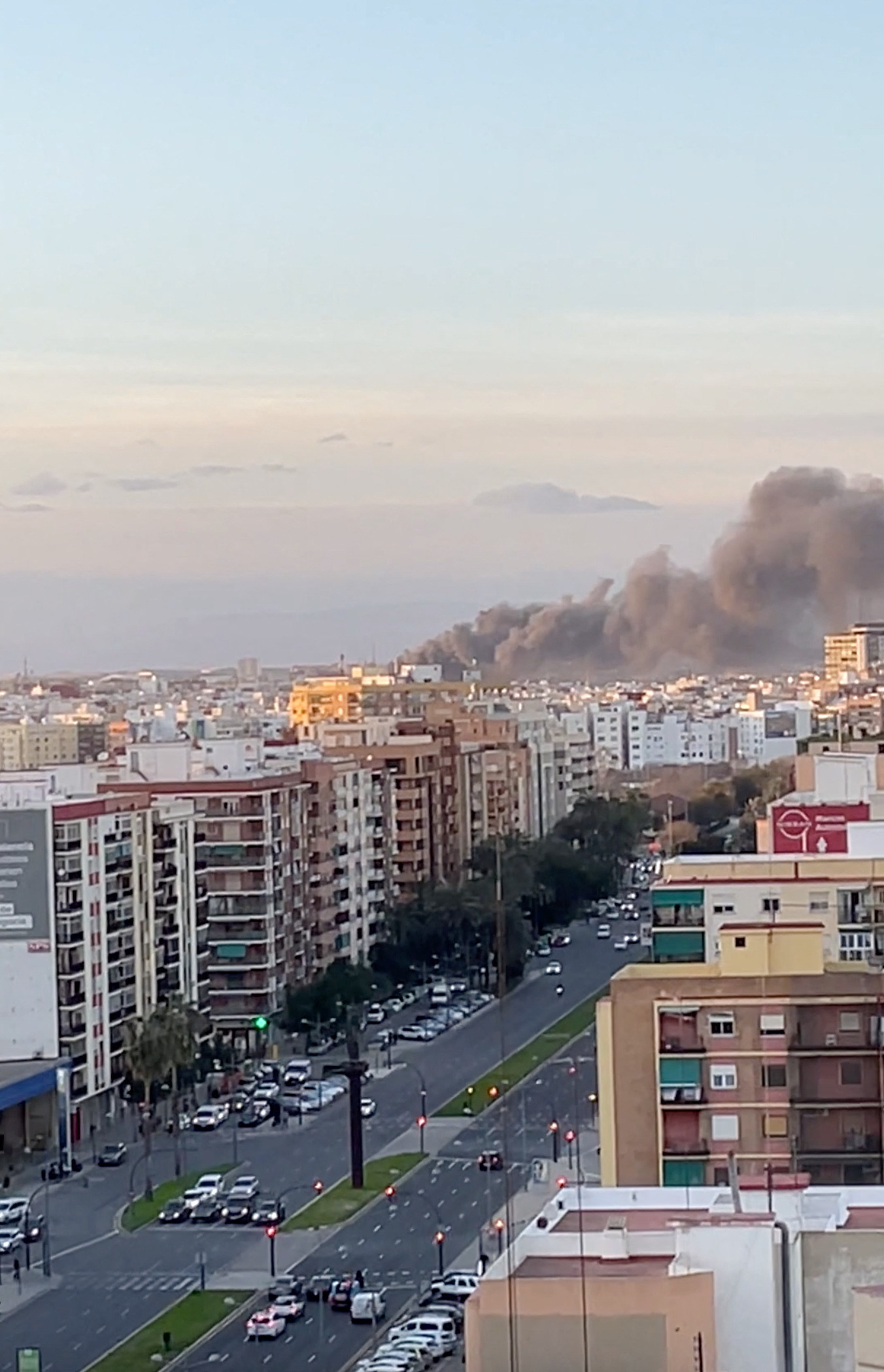 Spanish firefighters battle blaze engulfing apartment building in ...