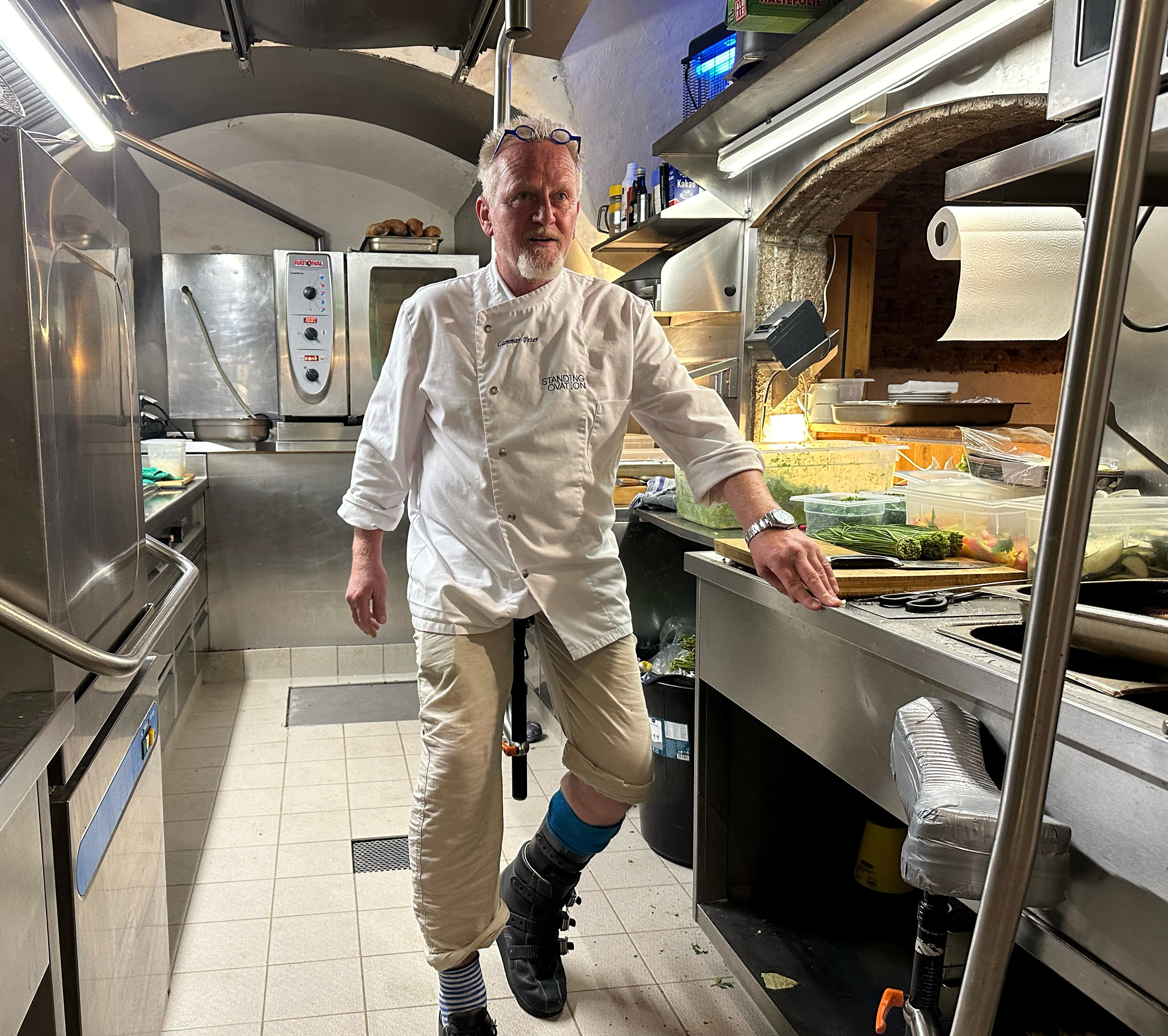 Austrian chef defies injury with floating kitchen seat | Reuters