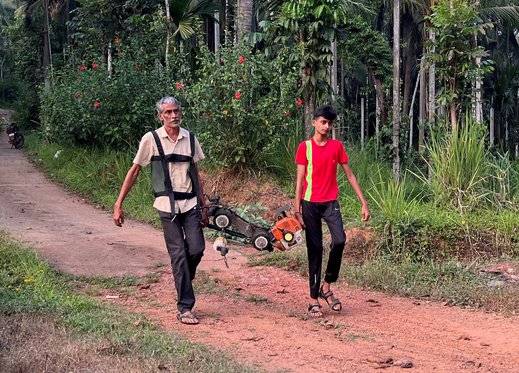 Indian farmer builds 'tree scooter' to zoom up tall areca palms | Reuters