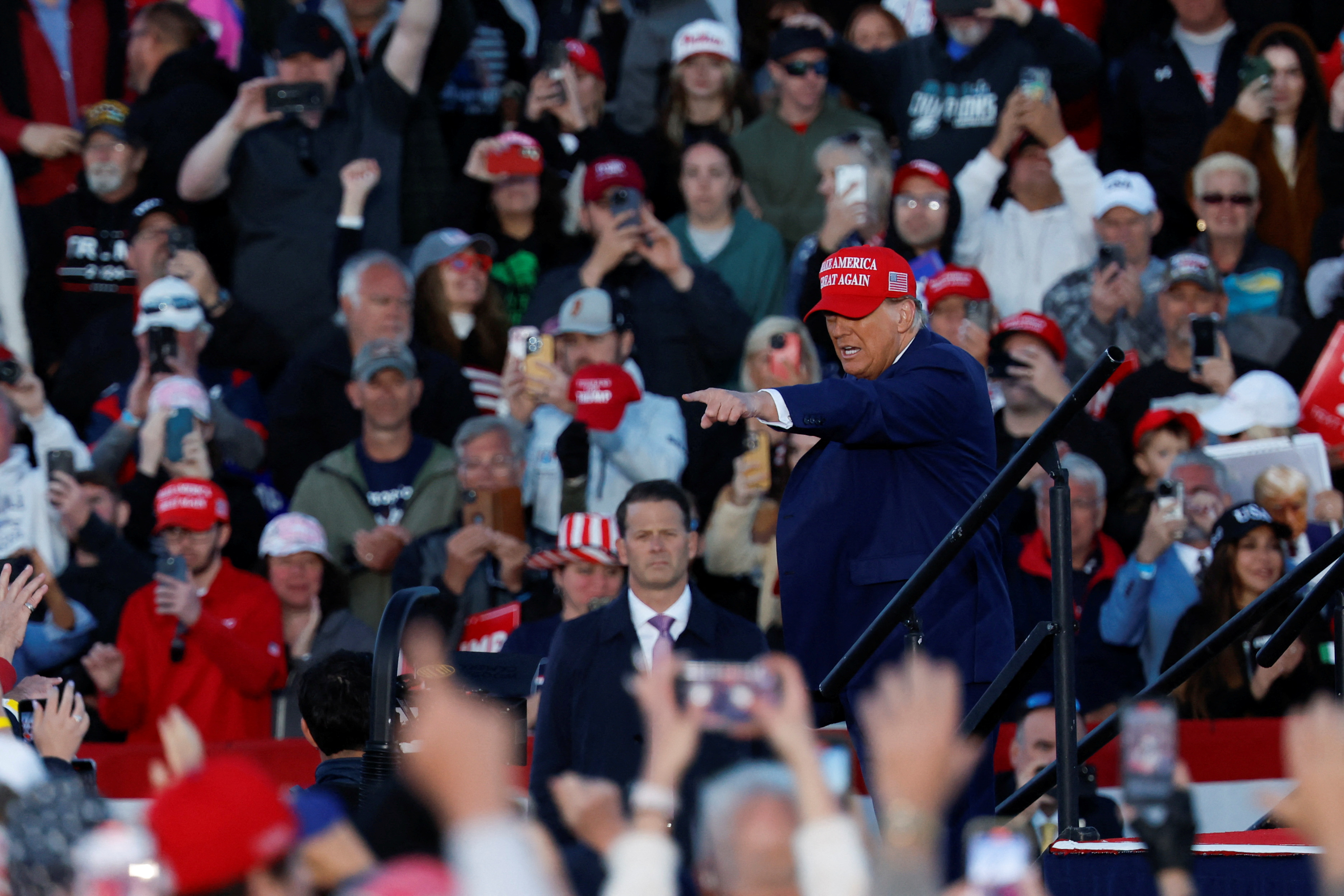 Trump again attacks New York prosecutor, floats economic plans at New ...